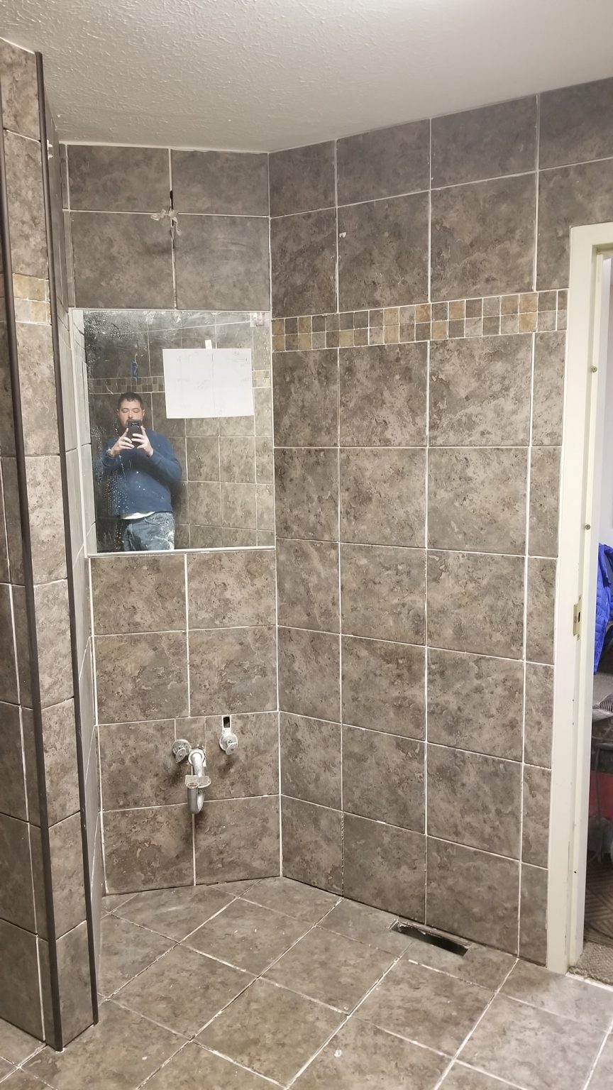 Men's common restroom remodel - Brook Pointe Resort