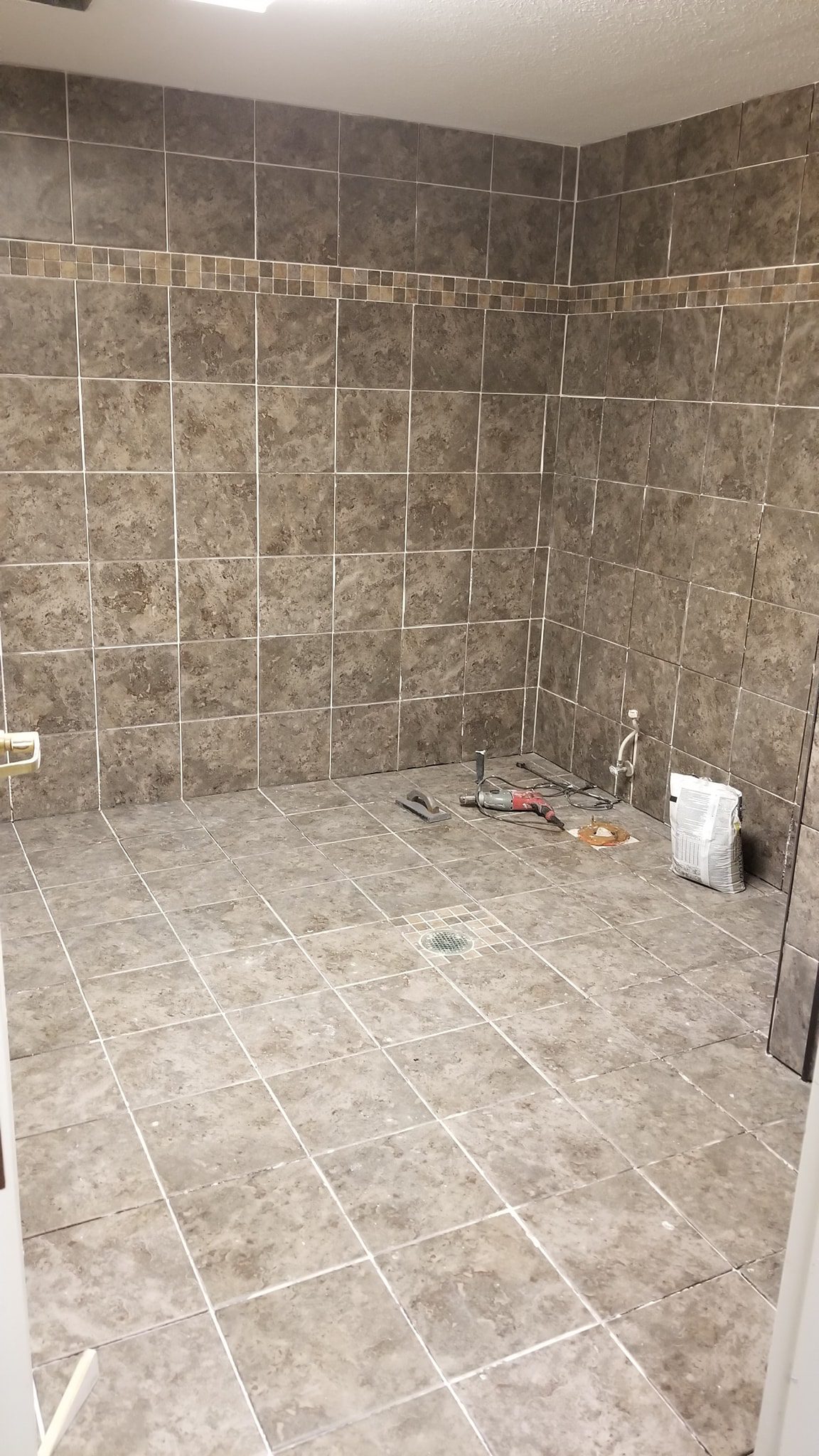 Men's common restroom remodel - Brook Pointe Resort